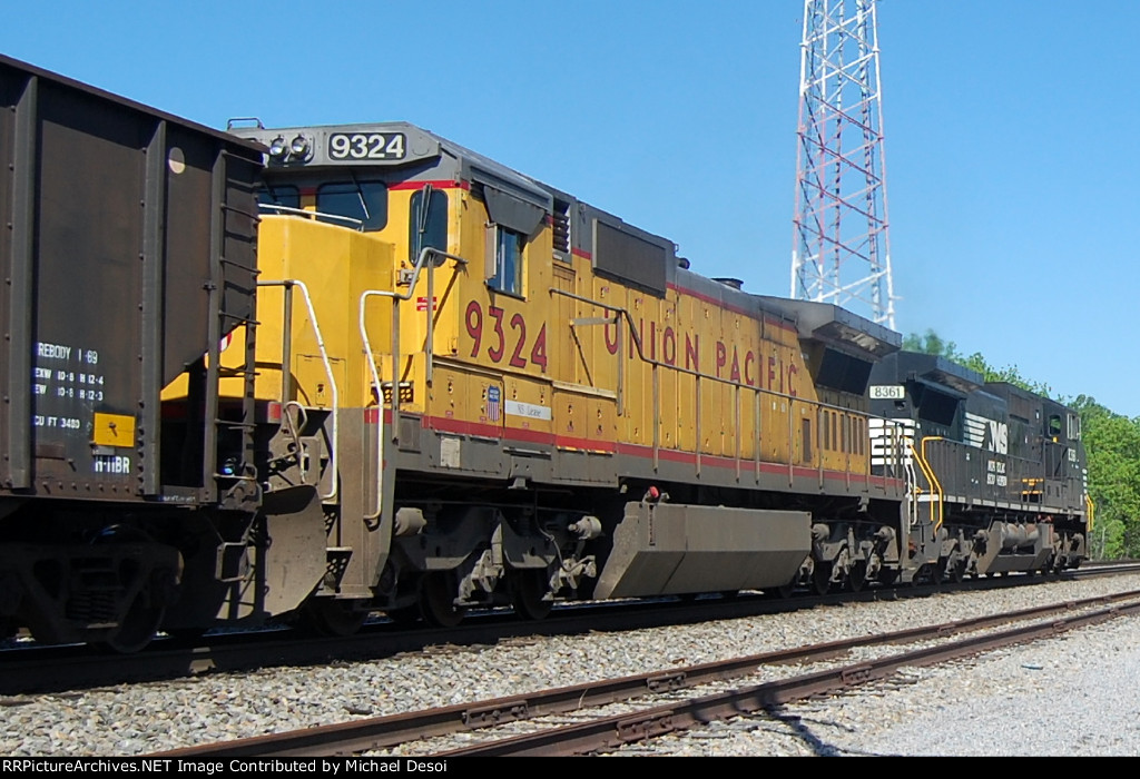 UP C40-8 #9324 is last out on a 2 unit lashup westbound crossing Main St.